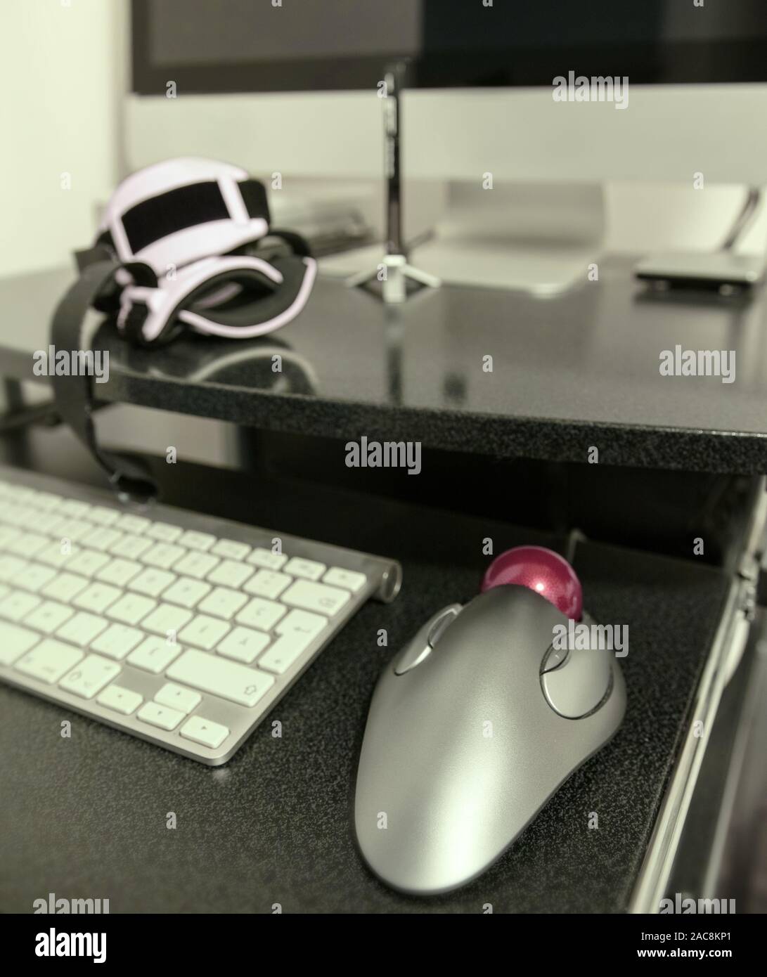 Forearm band, computer k-board, and a track-ball Stock Photo - Alamy