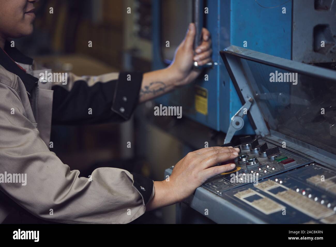 Closeup industrial machine operator operating hi-res stock photography ...