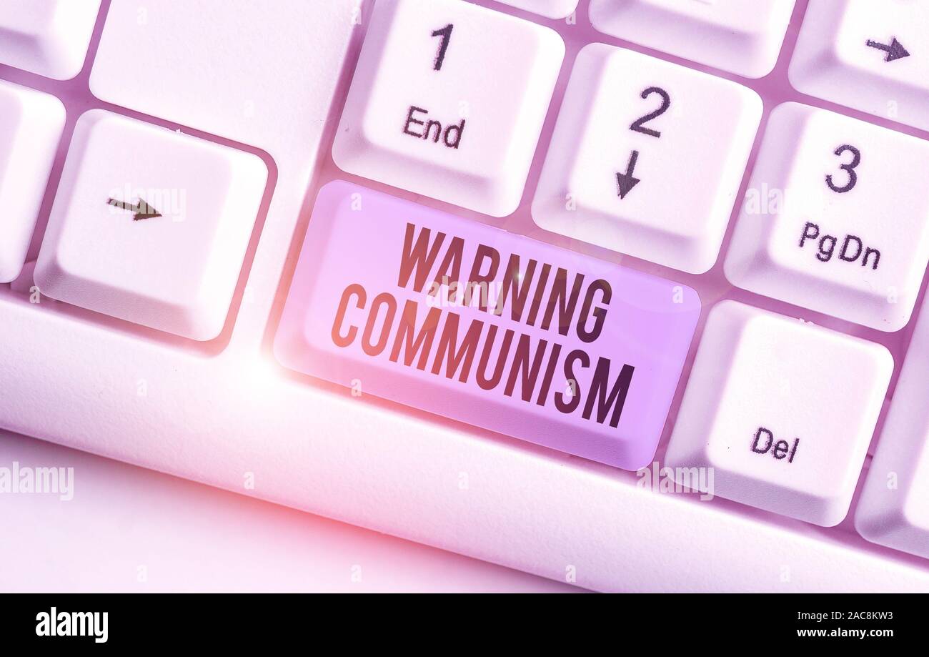 Writing note showing Warning Communism. Business concept for economic ...
