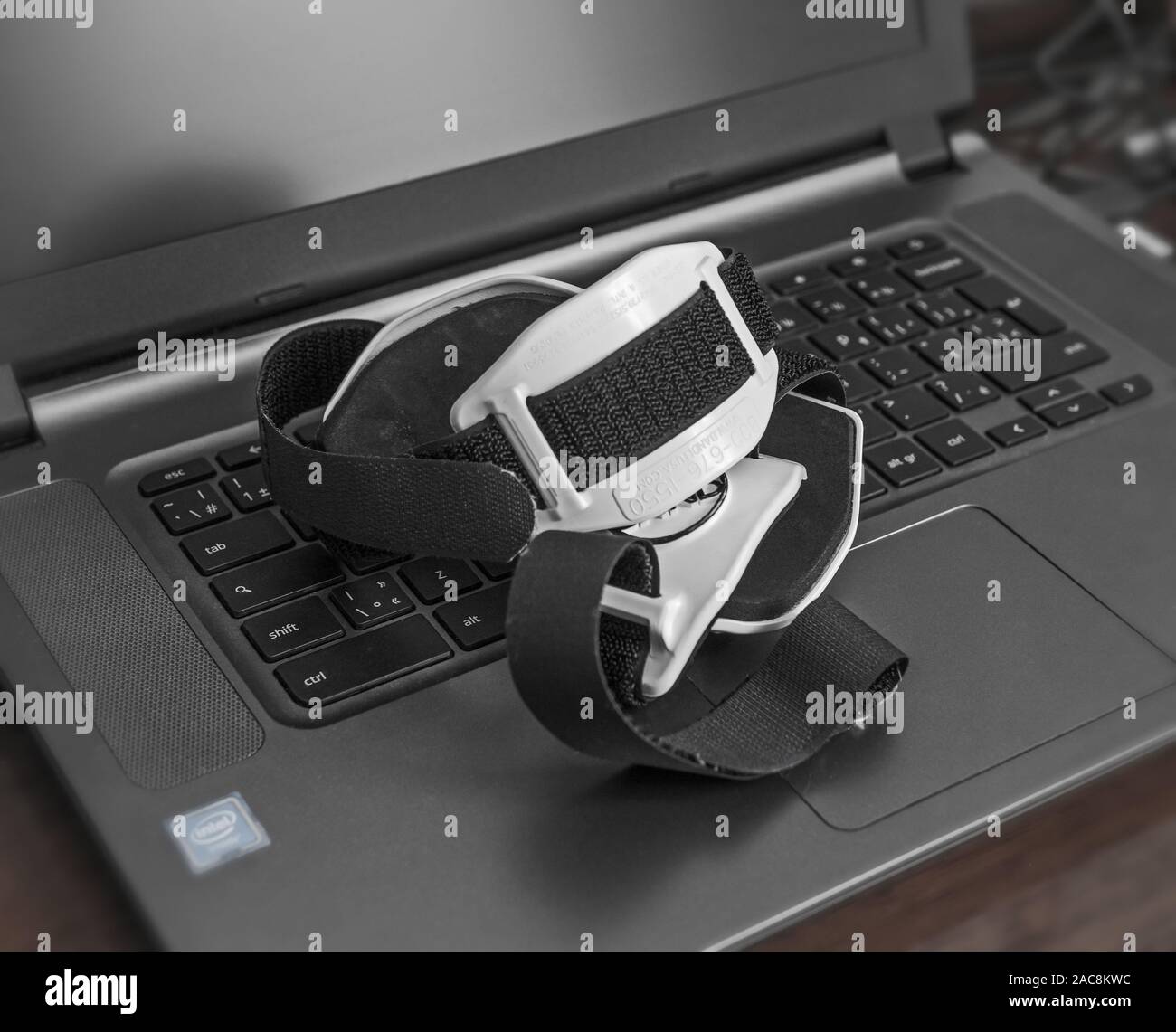 Forearm band on one's computer k-board Stock Photo - Alamy