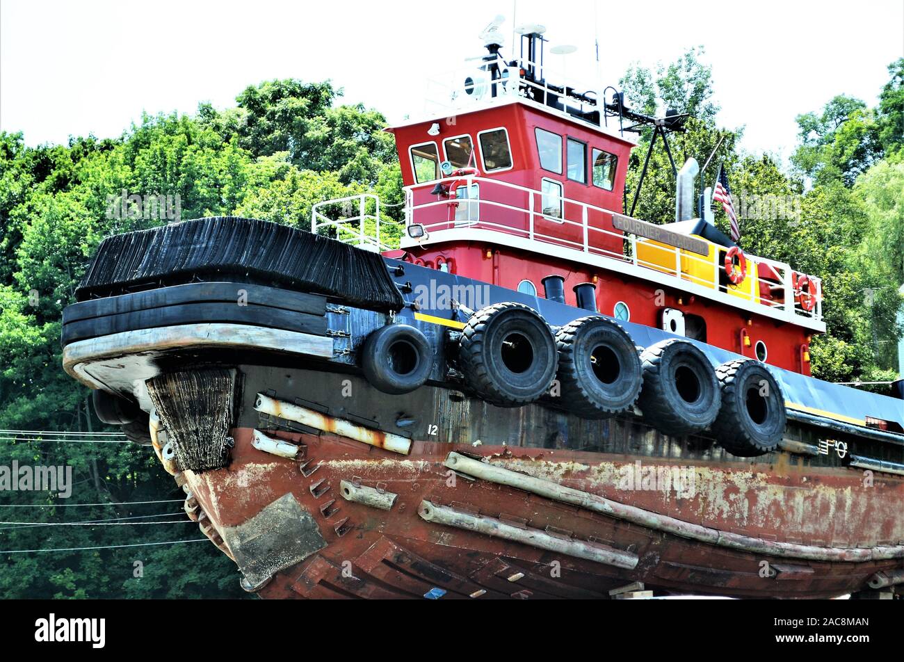 Old sea going tug in drydock Stock Photo - Alamy