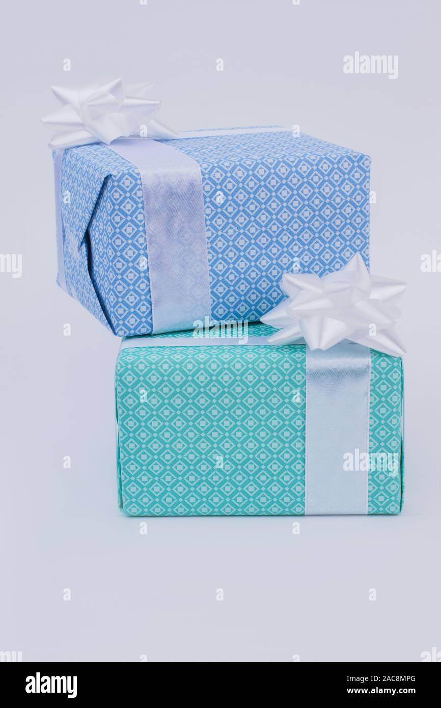Two gift boxes wrapped in beautiful paper Stock Photo - Alamy