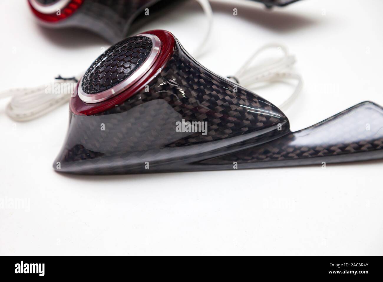 Two high-frequency speakers from a car with carbon fiber housings with ...