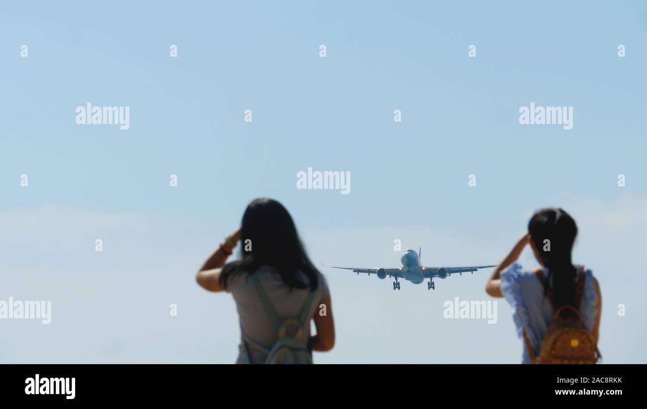 The plane flies overhead Stock Photo - Alamy