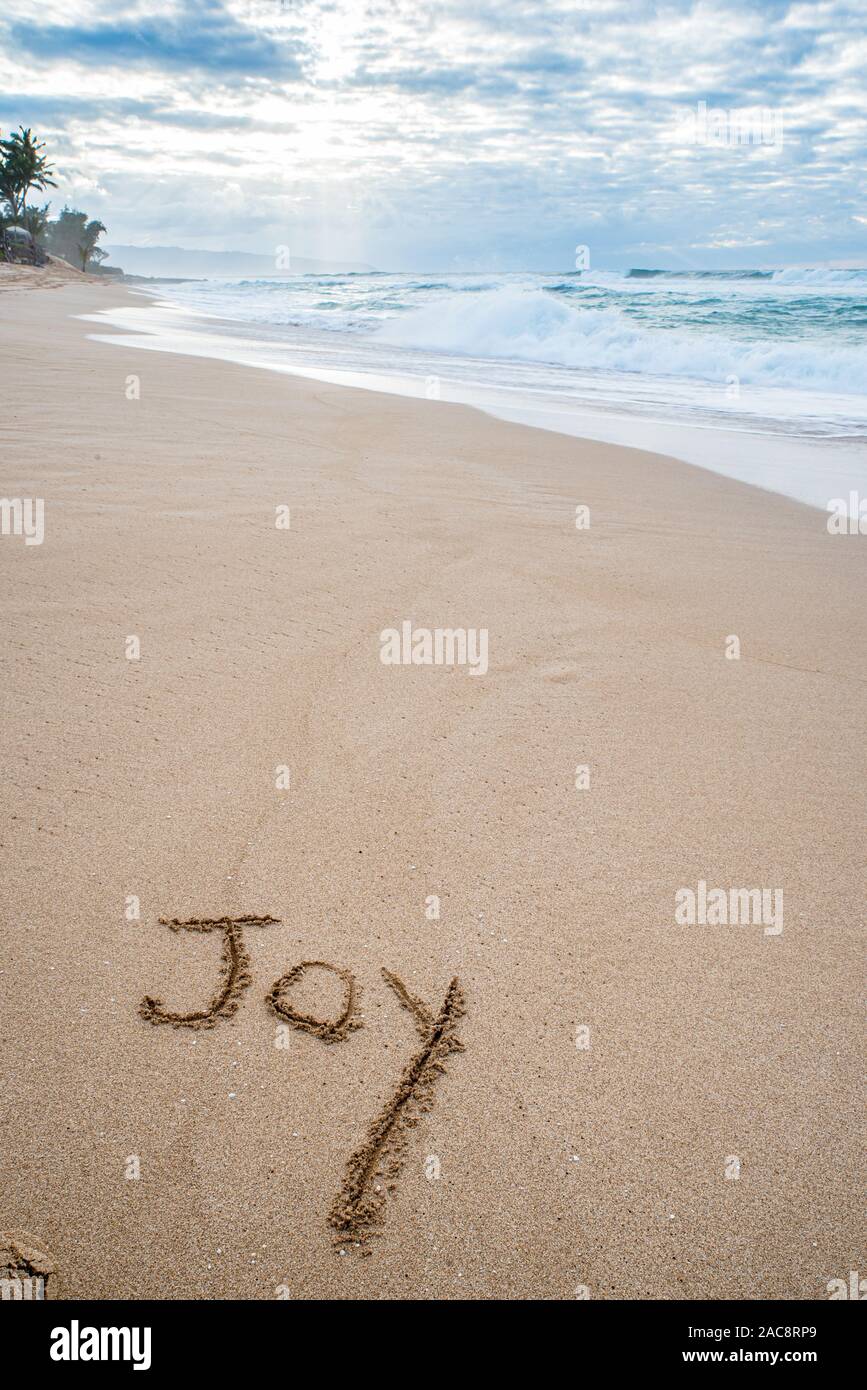 Joy written in sand on hi-res stock photography and images - Alamy