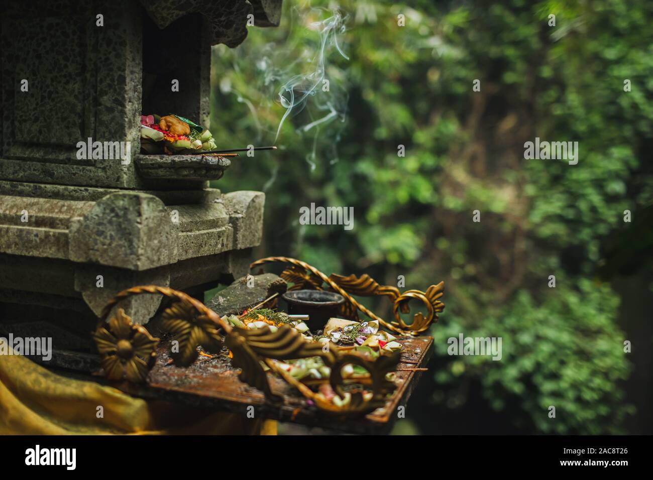 Traditional balinese Canang Sari offerings to gods and spirits with ...