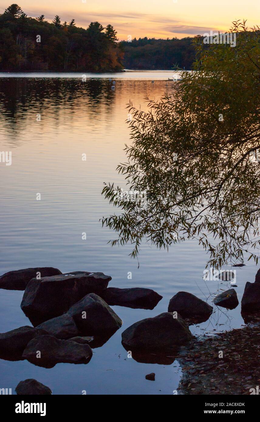 Sunset sky reflected in the rippled waters of the Hopkinton Reservoir ...
