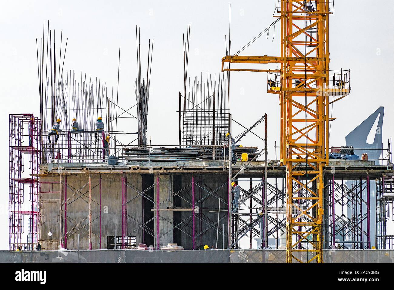 Aerial view of a building construction with tower crane, scaffolding ...