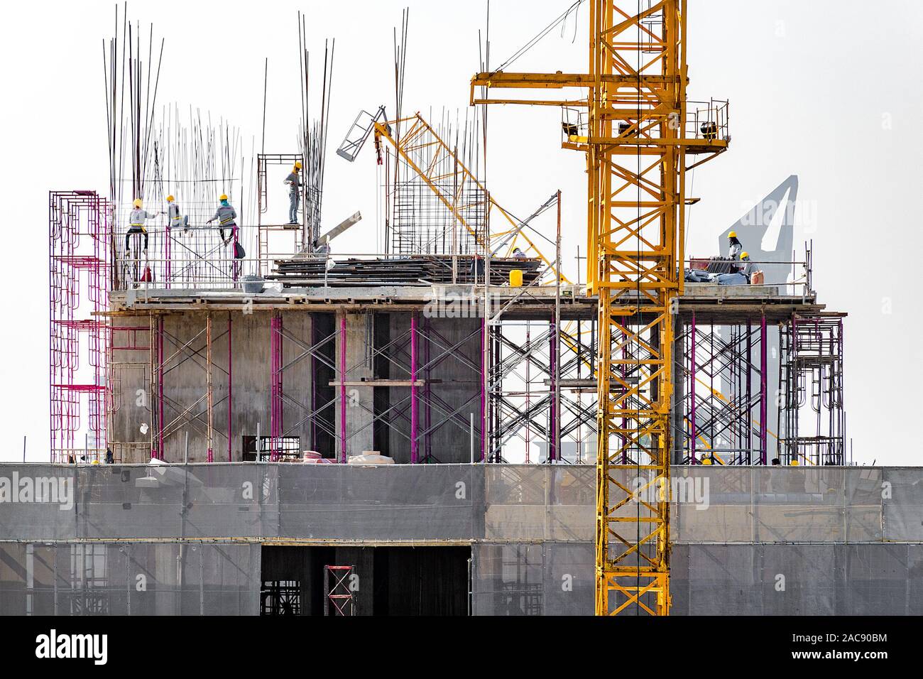 Aerial view of a building construction with tower crane, scaffolding ...