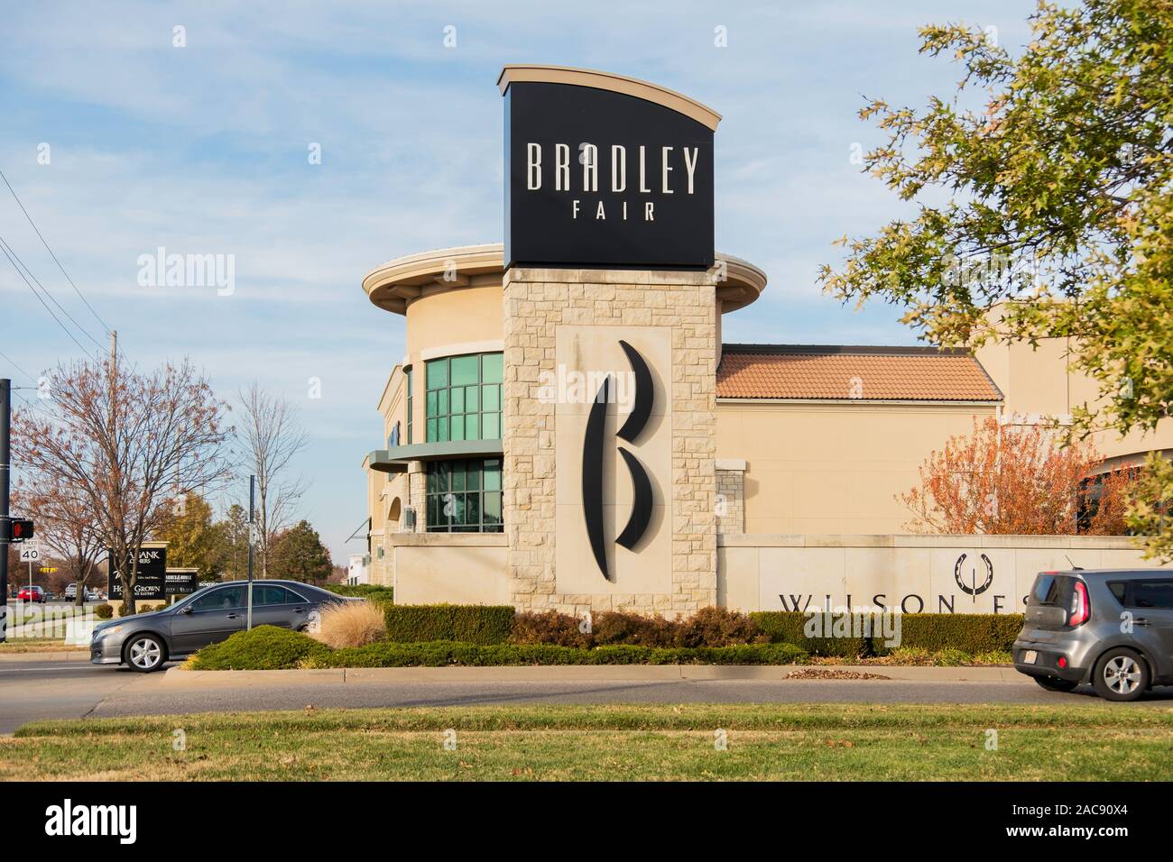 Entrance and stone pillar with signage advertising Bradley Fair mall in ...