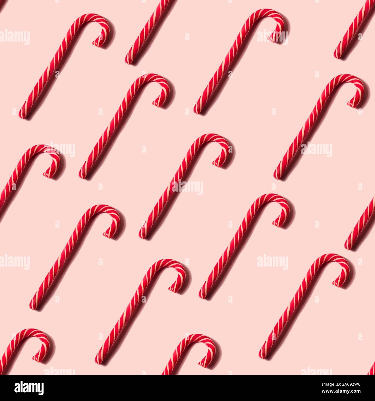 Seamless Christmas texture made of random candy cane and Santa hat on ...