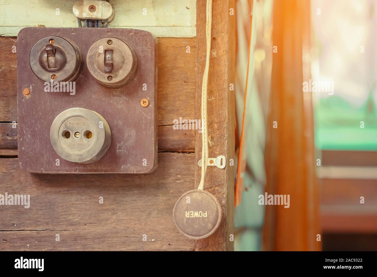 Old electric light switch on a wooden wall hi-res stock photography and ...