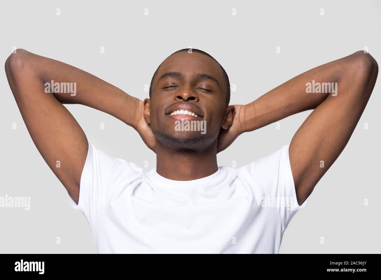 Man relaxing with hands behind head hi-res stock photography and images ...