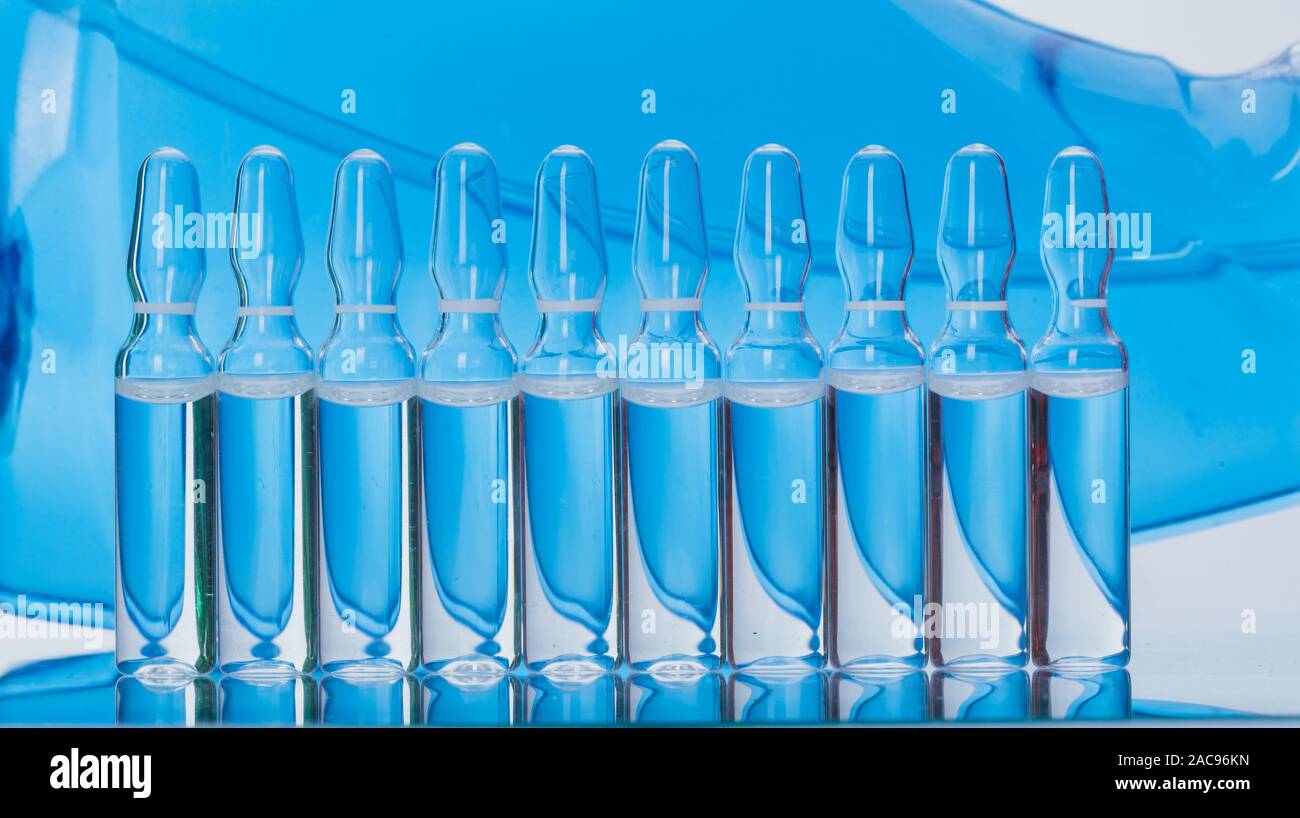 Glass medical ampoule vial for injection. Medicine is liquid sodium ...