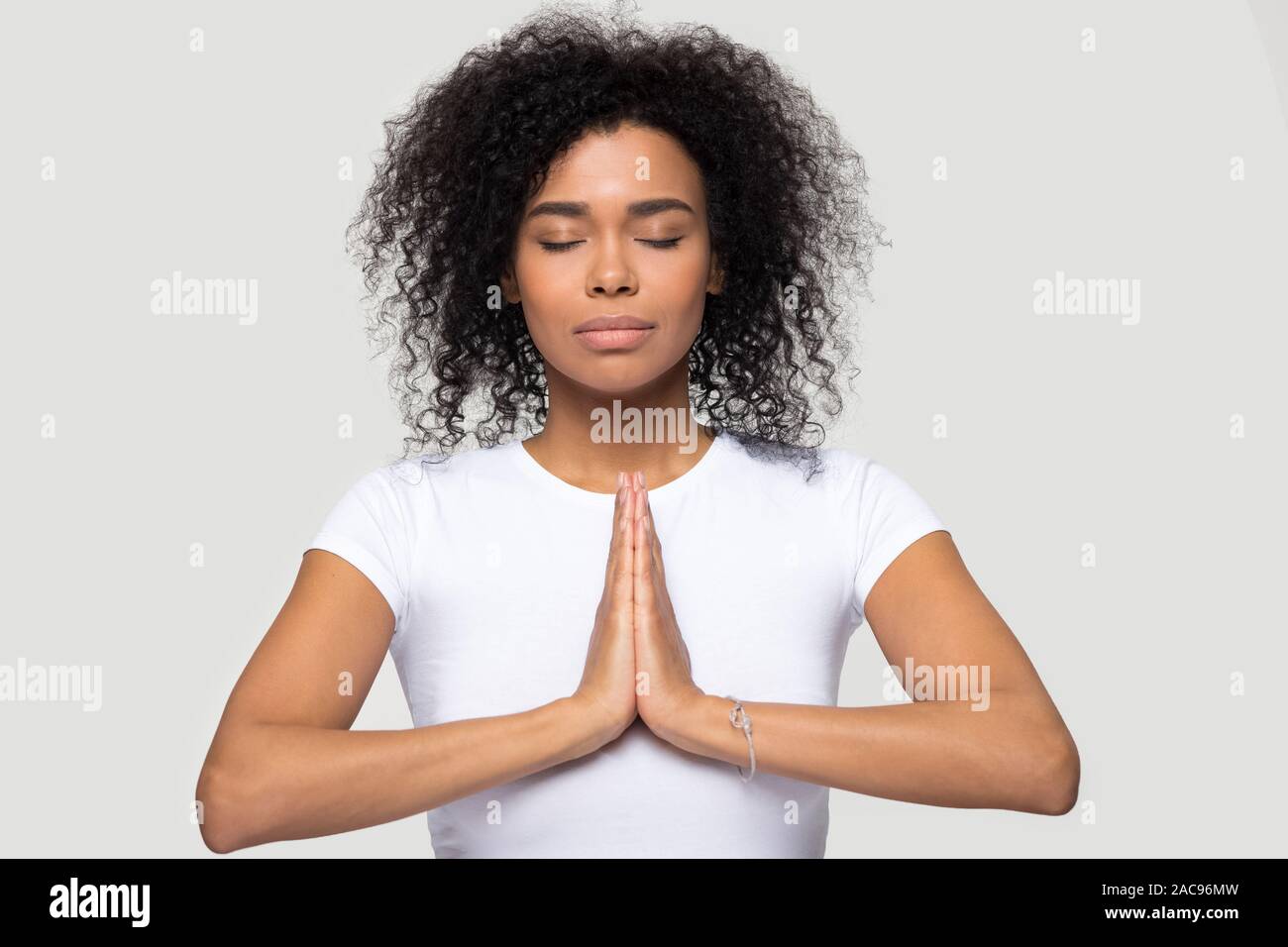 Black woman person meditating hi-res stock photography and images - Alamy
