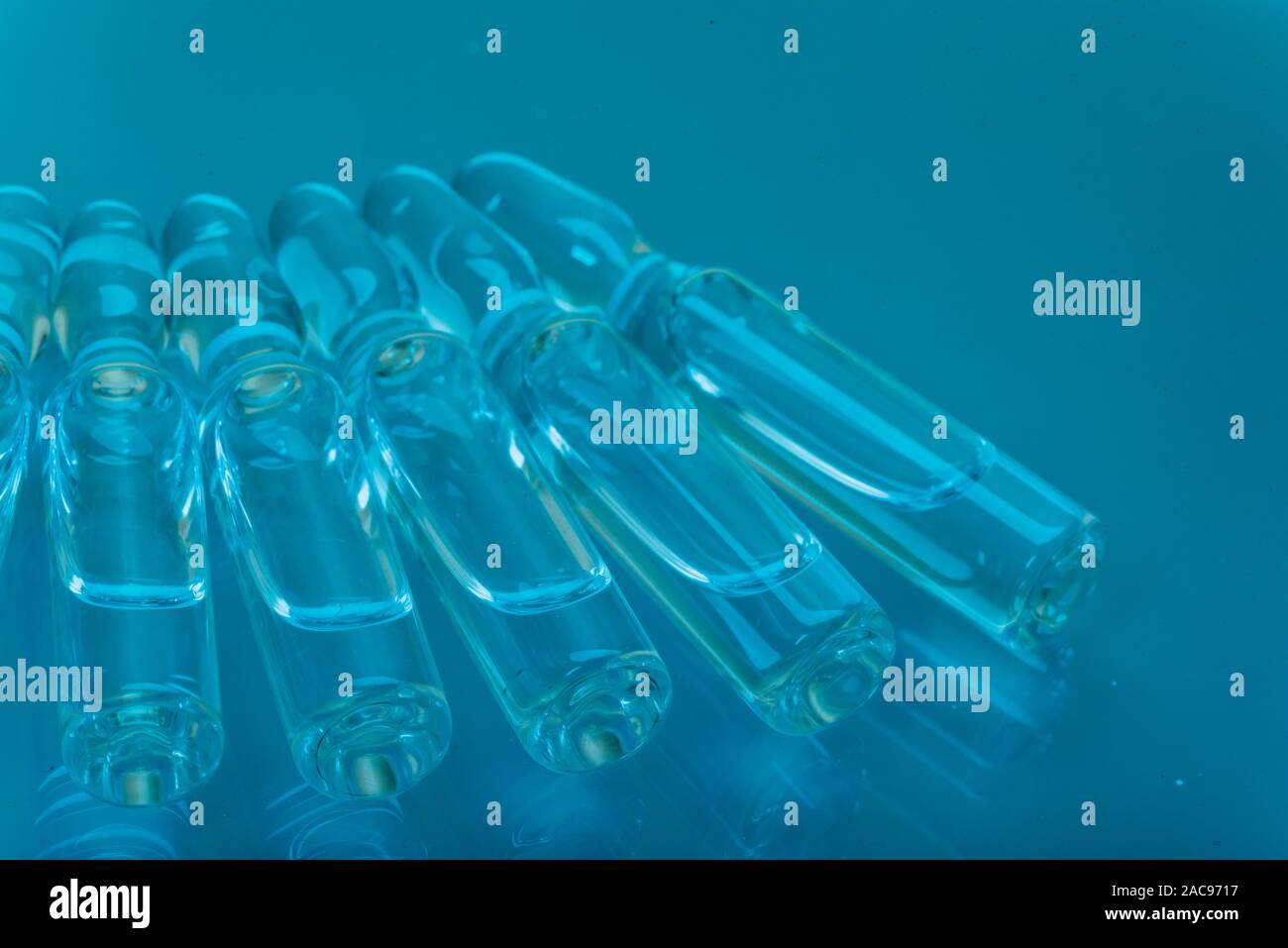Glass medical ampoule vial for injection. Medicine is liquid sodium ...