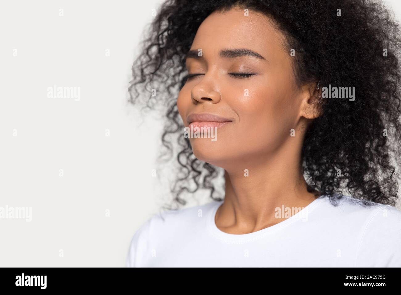 Calm peaceful African American woman breathing deep close up Stock ...