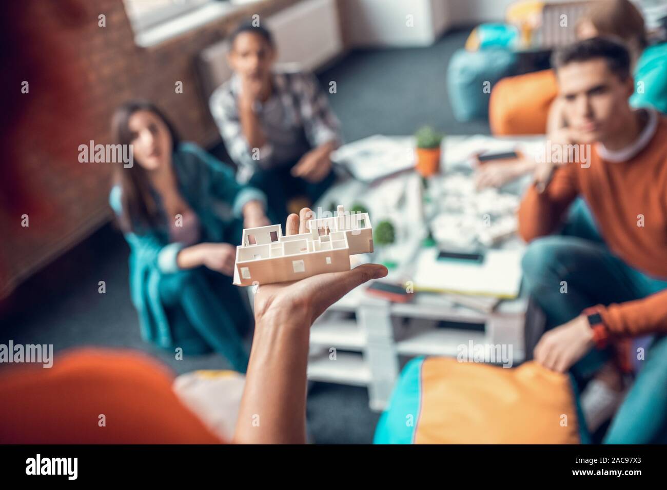 Enjoying team work. Cheerful positive students enjoying their team work ...