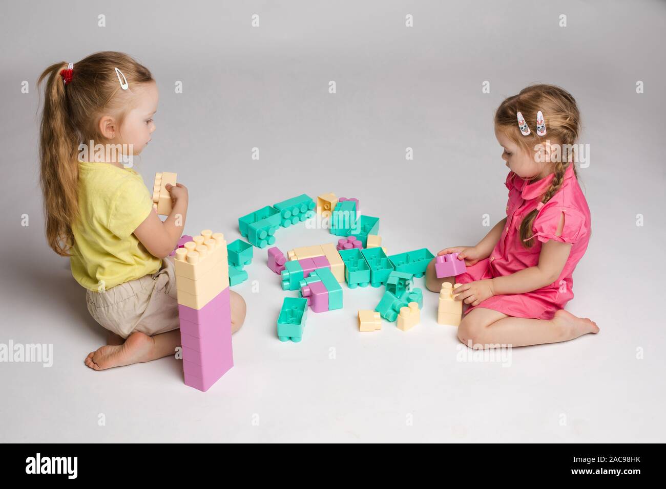 Two Girls Building Blocks High Resolution Stock Photography and Images ...