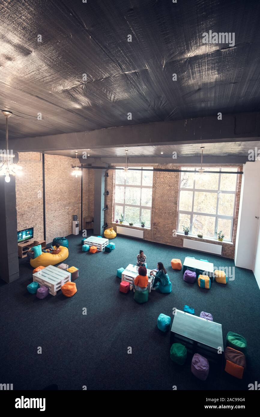 Students having rest. Top view of students having rest in rest area ...