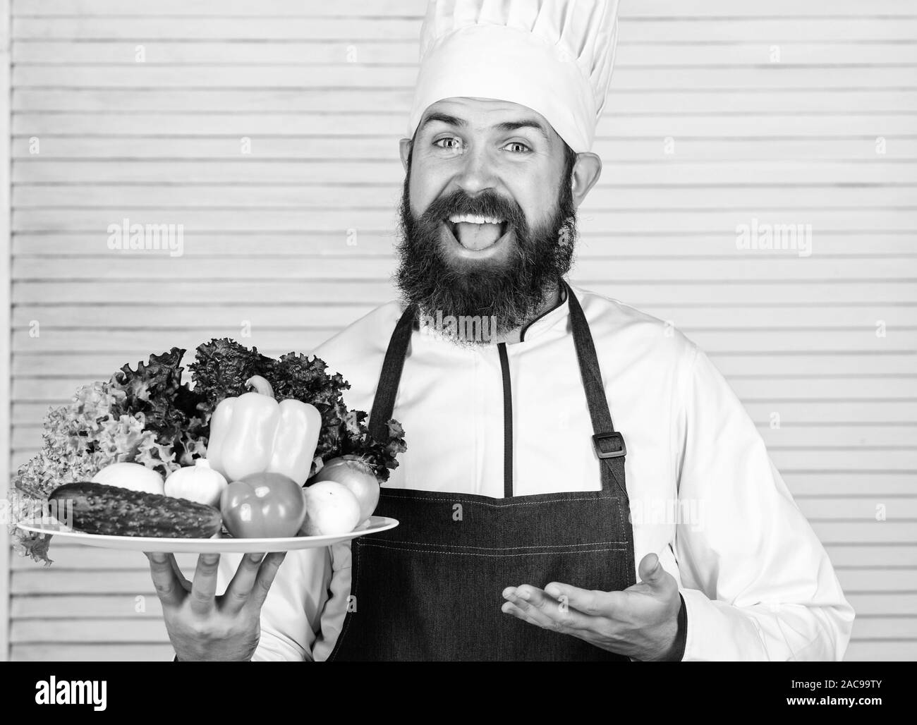 Man happy presenting excellent vegetables. Fresh harvest vegetables ...