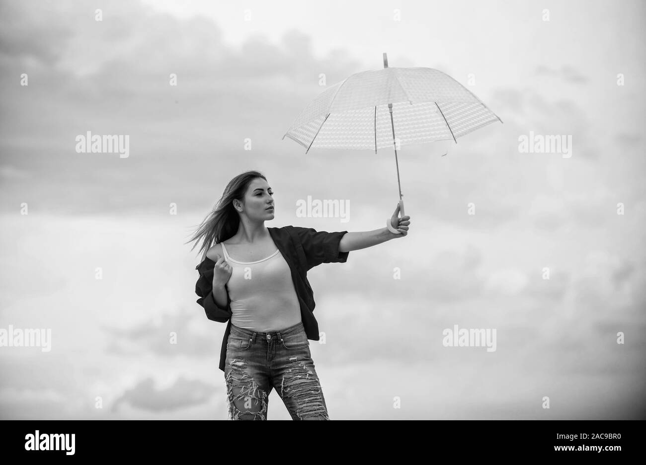 Wind of change. Pretty woman with light umbrella. Rainbow umbrella ...