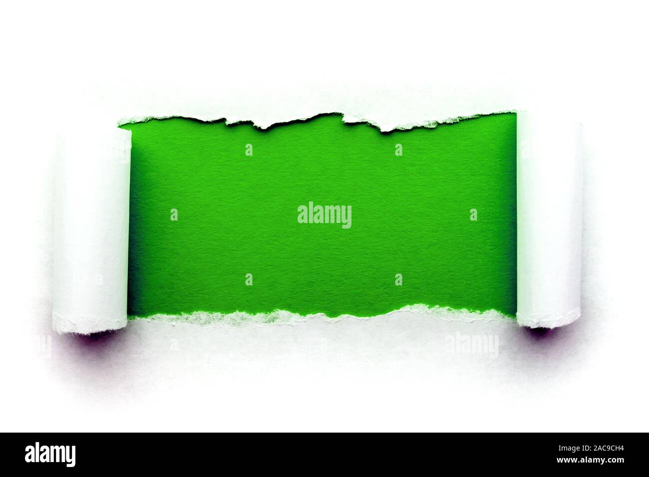 A hole in white paper with torn edges isolated on a white background ...