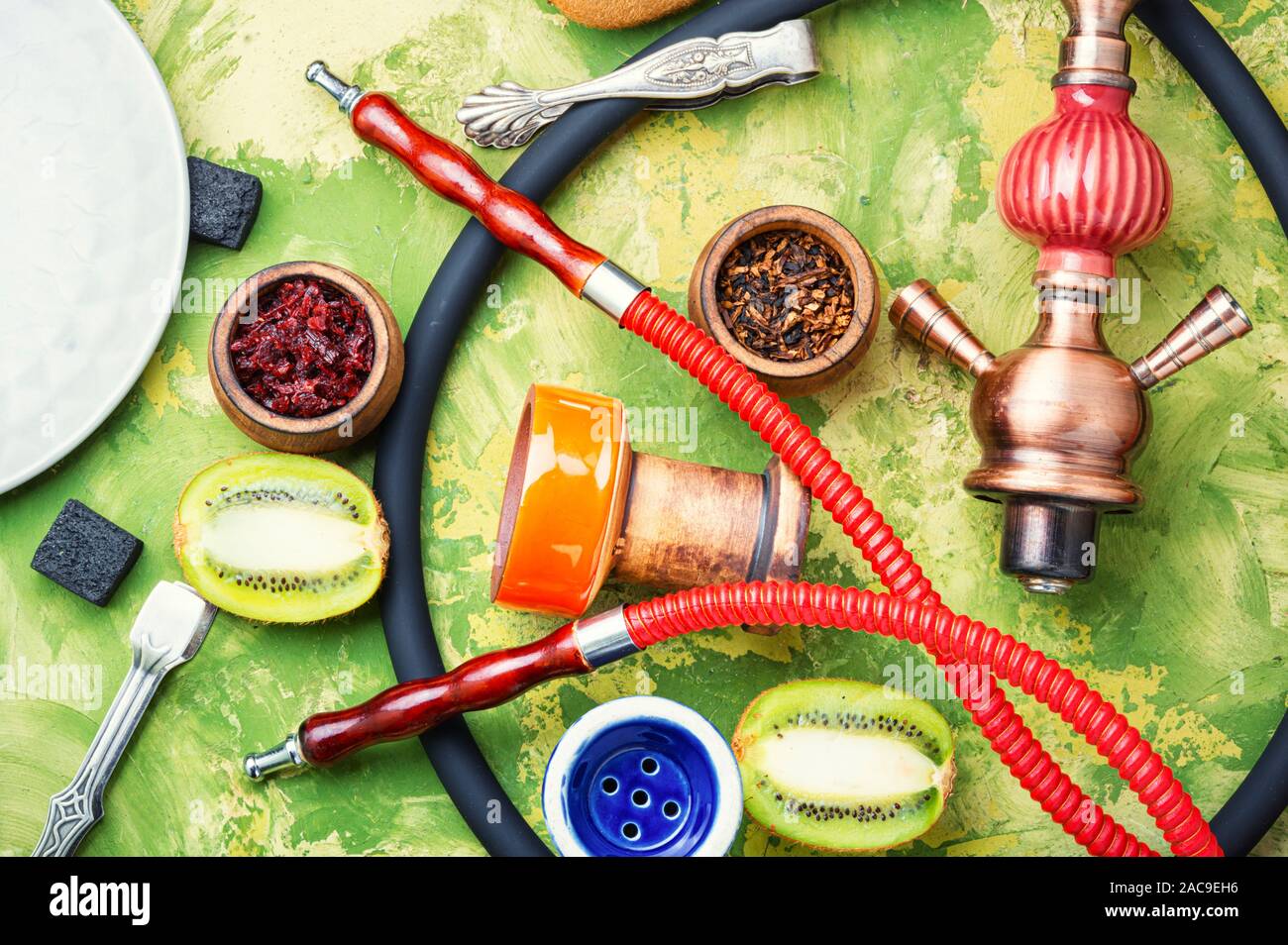 Arabic smoking hookah with taste of kiwi.Fruit shisha tobacco. Tobacco ...