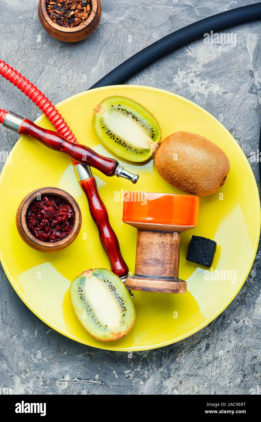 Arabic smoking hookah with taste of kiwi.Fruit shisha tobacco. Tobacco ...