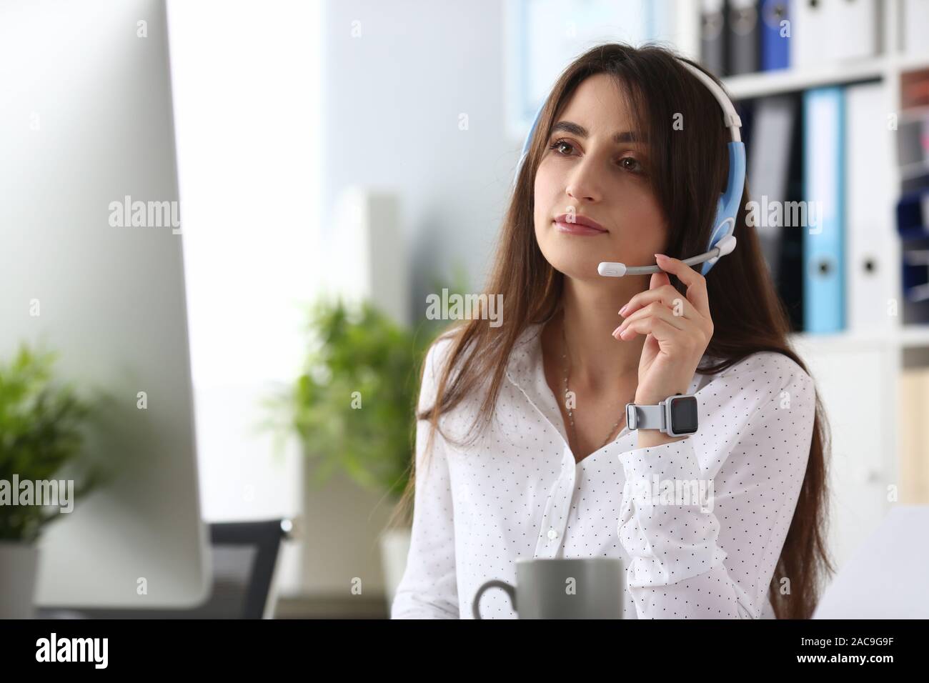 Pretty woman looking at computer Stock Photo - Alamy