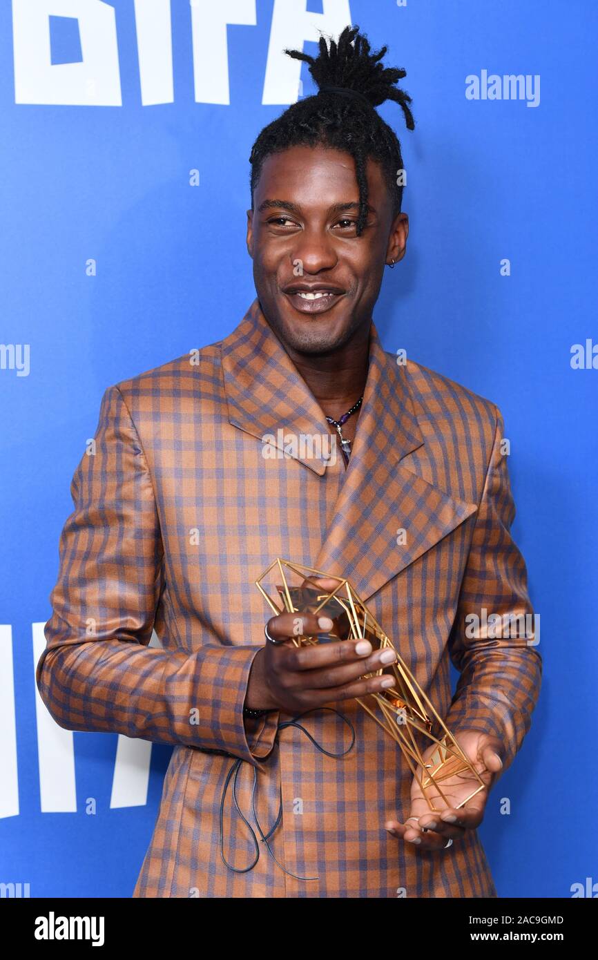 Sam Adewunmi with the Most Promising Newcomer award, in the press room ...