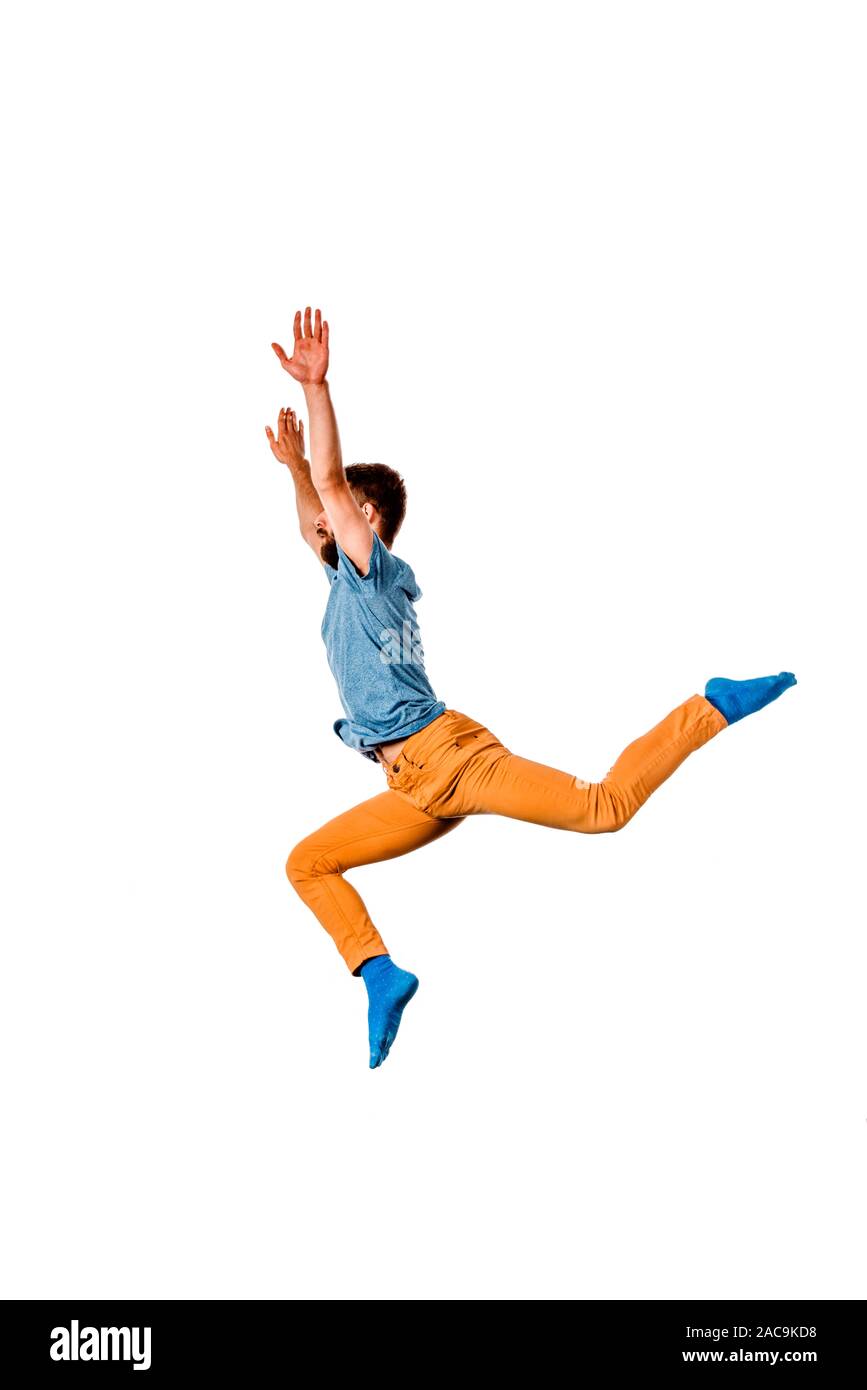 Portrait of a young man dancing of joy. Isolated image on white ...