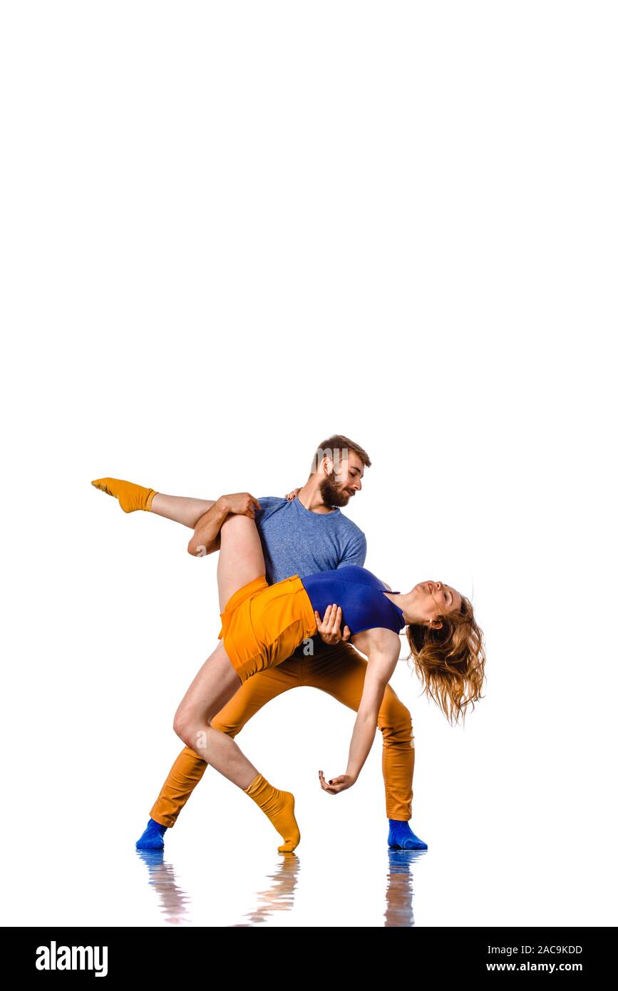 The two young modern ballet dancing over white studio background Stock ...