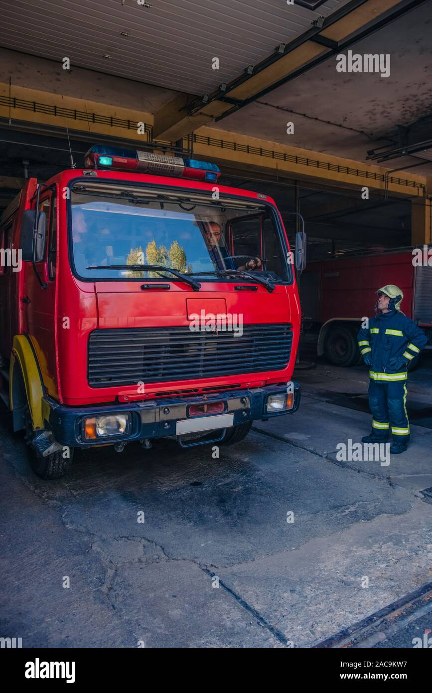 Fire engine inside the garage of the fire department Stock Photo - Alamy
