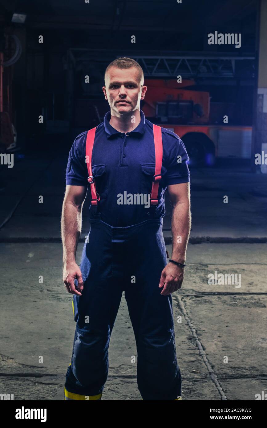 Portrait of a firefighter with uniform inside the fire station Stock ...