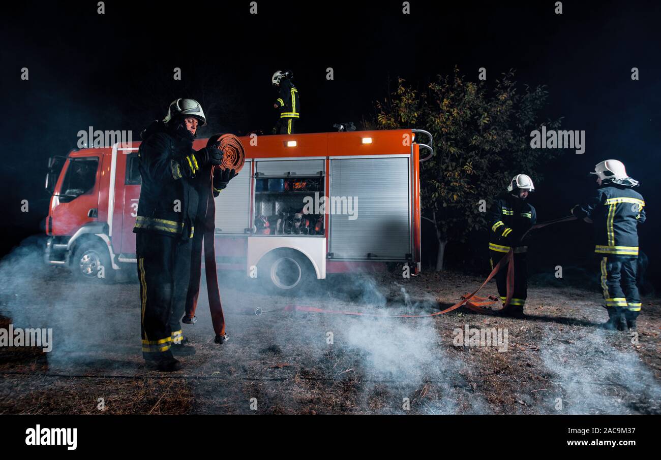 Fire department in the field during a fire emergency situation Stock ...