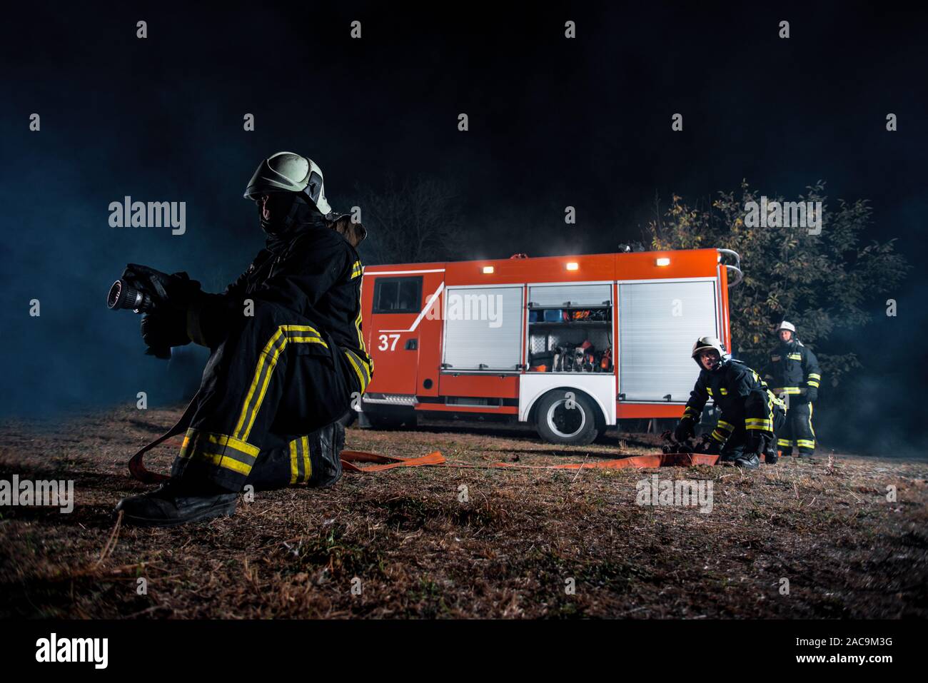 Fire station crew responding to fire emergency situation Stock Photo ...