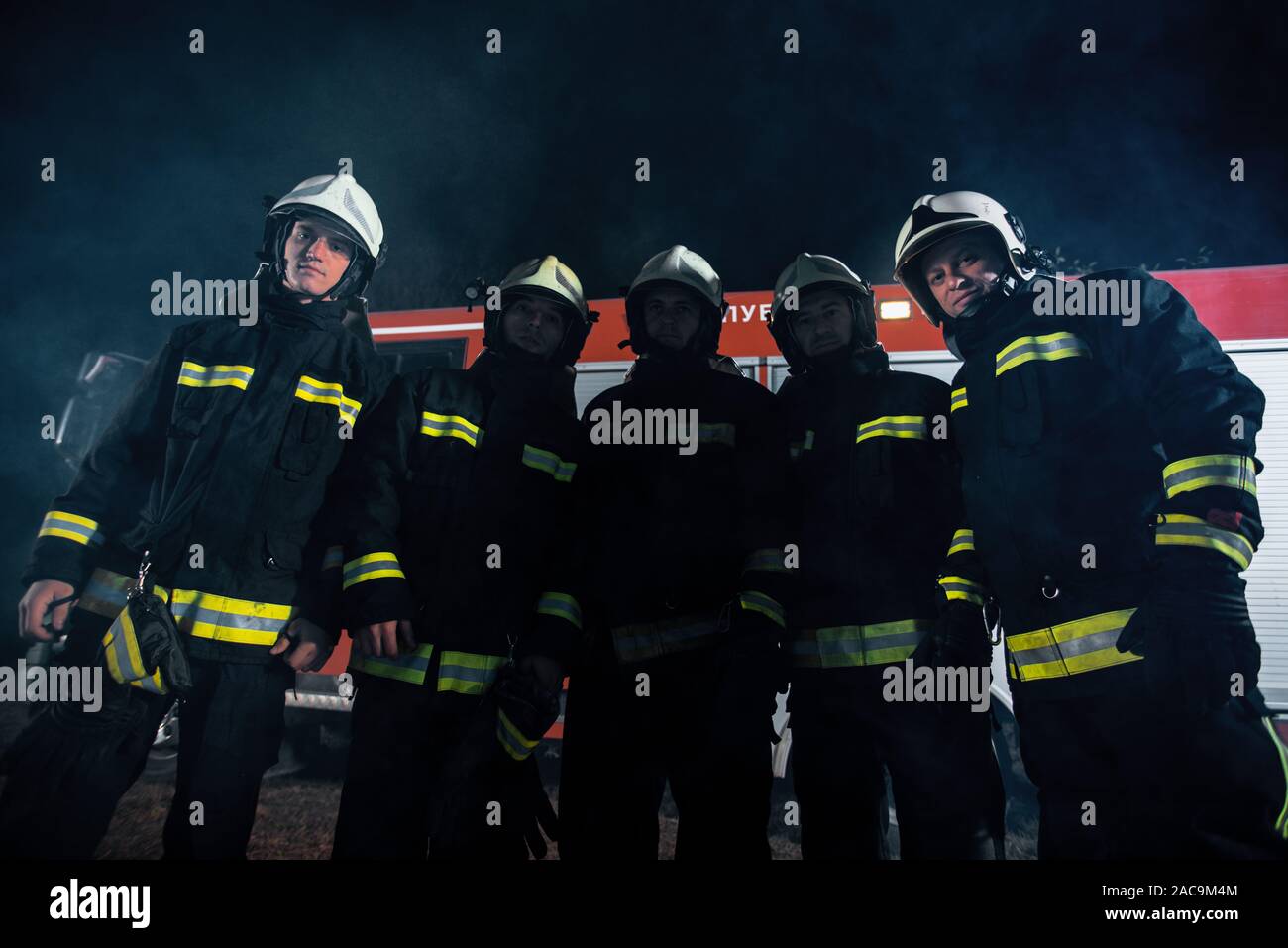 Firemen getting ready during a firefighting intervention Stock Photo ...