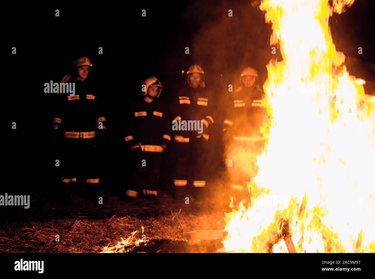 Firefighter in full uniform with mask hi-res stock photography and ...
