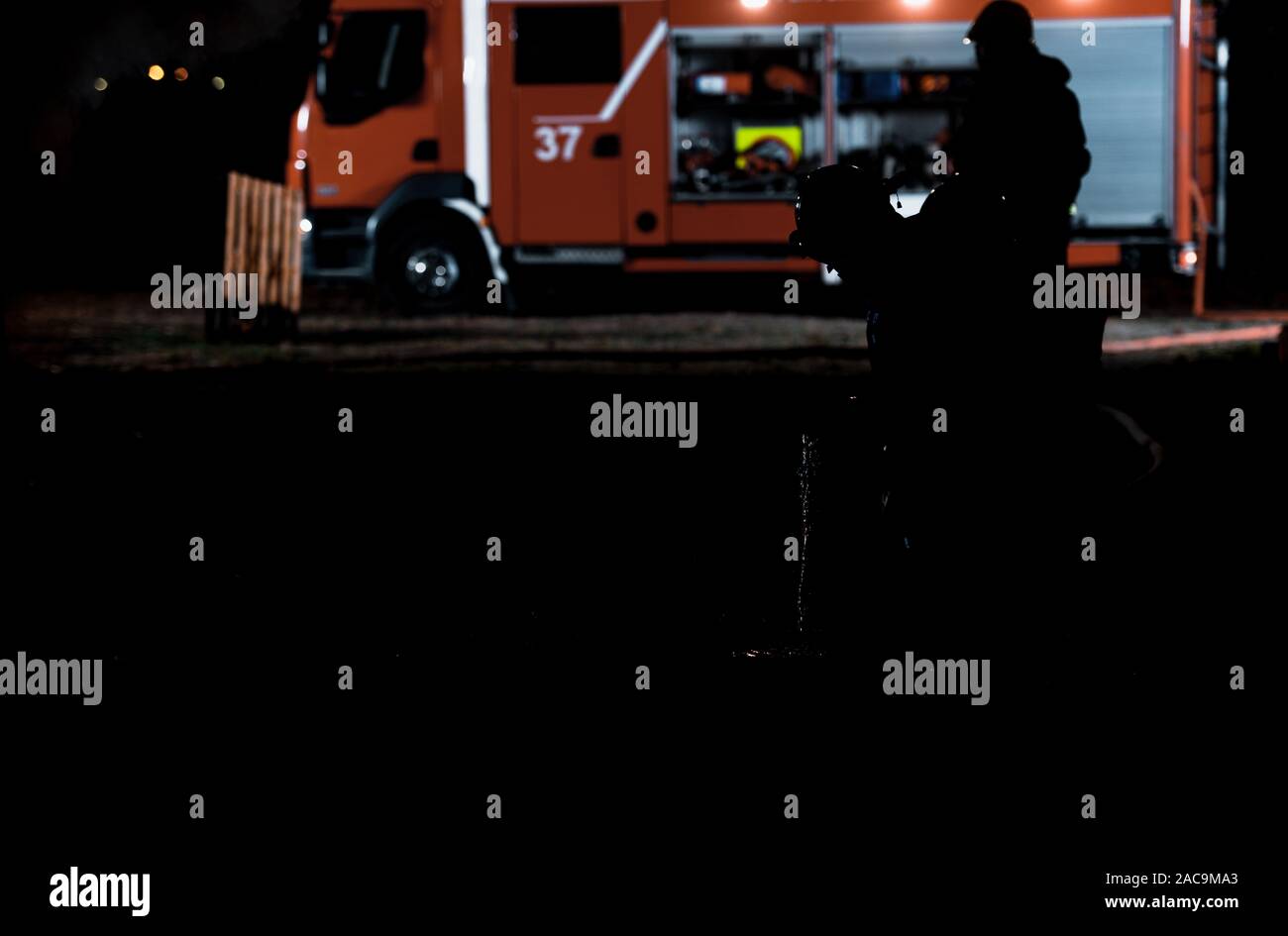 Fire department in the field during a fire emergency situation Stock ...