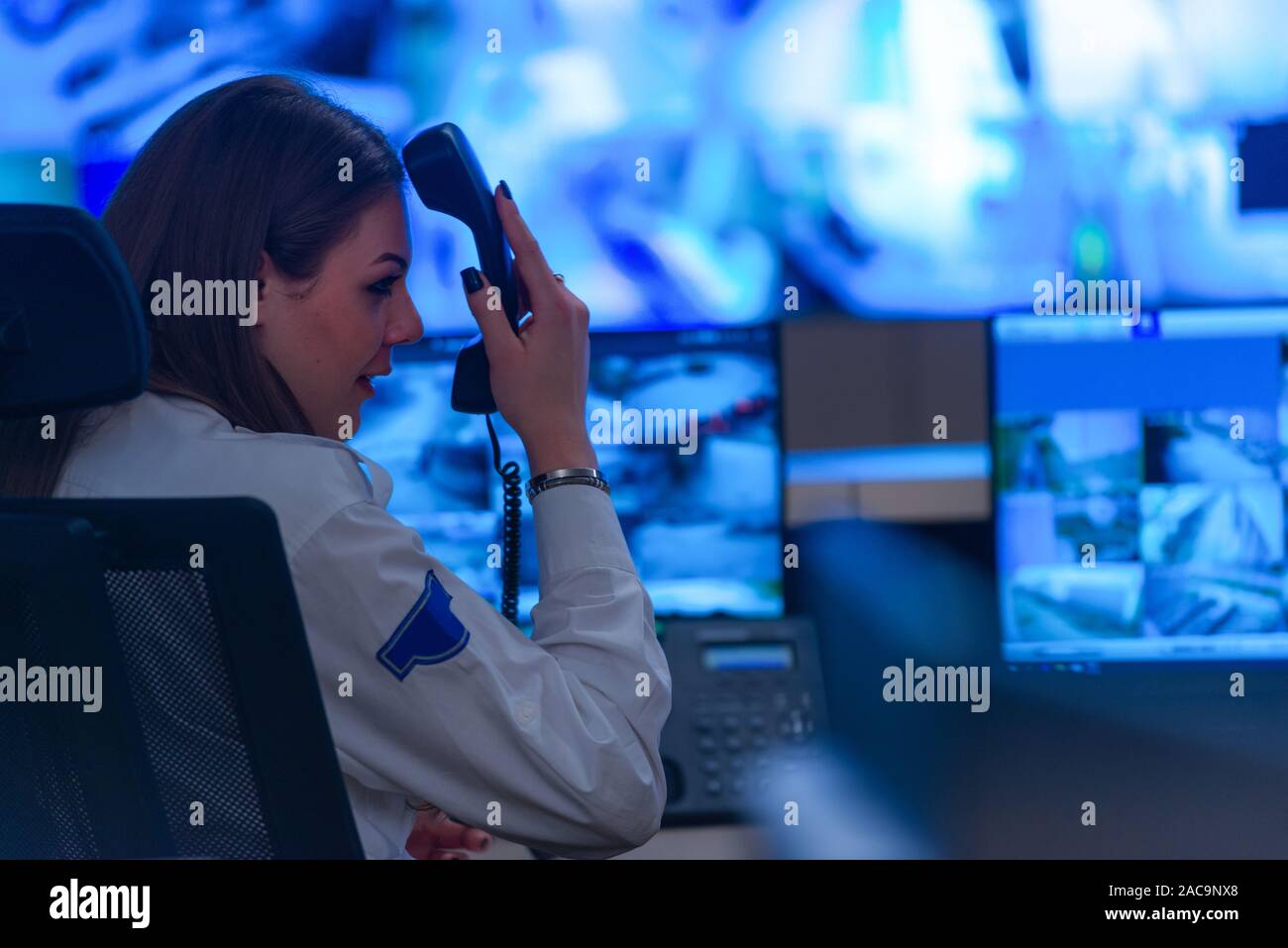 Technical Operator Works at His Workstation with Multiple Displays ...