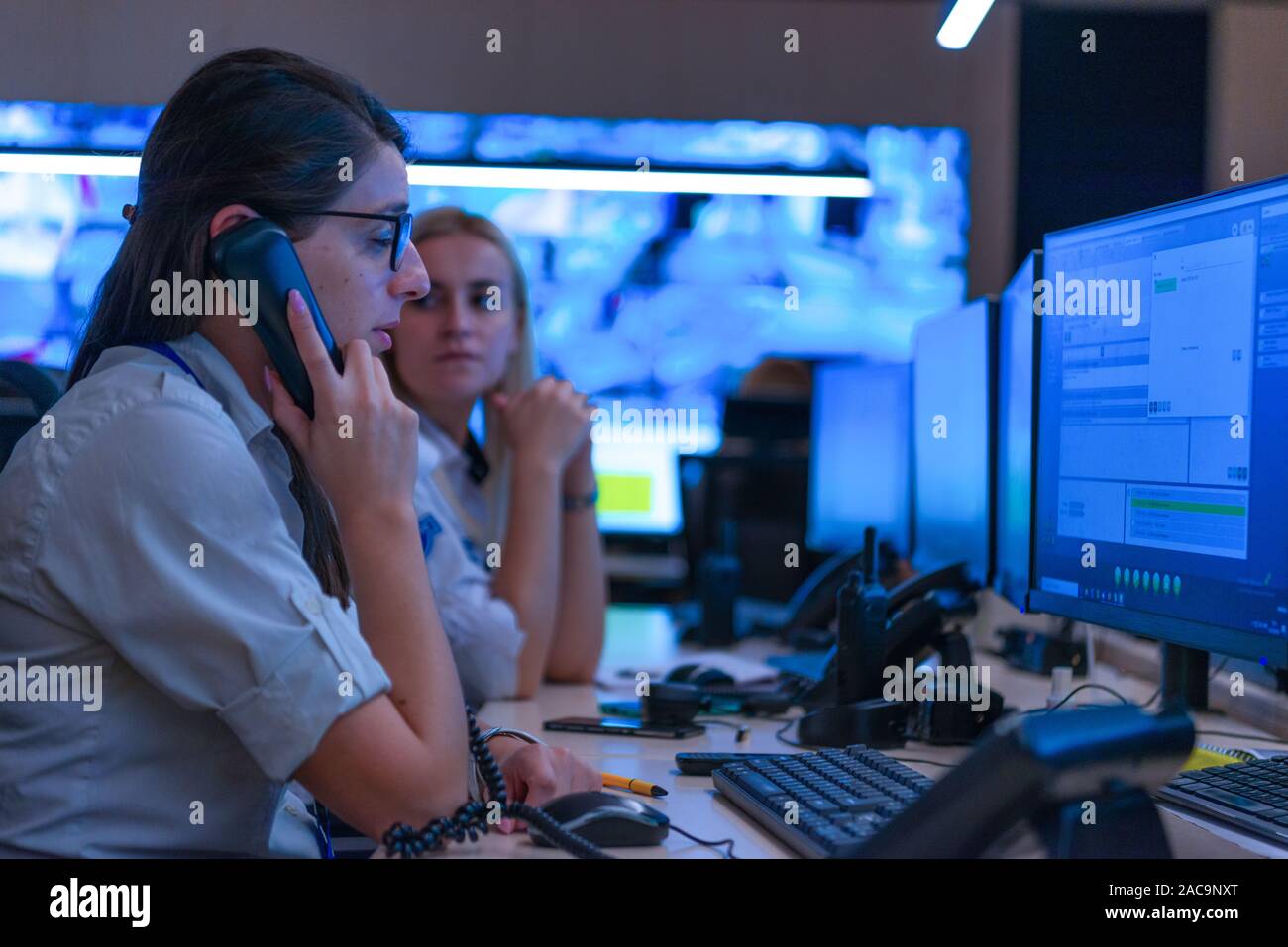 Technical Operator Works at His Workstation with Multiple Displays ...
