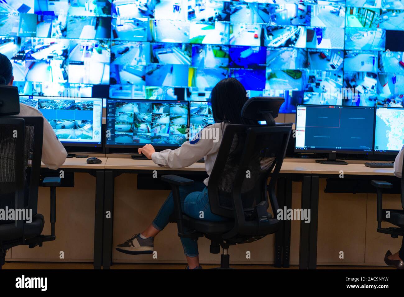 Team of secret agents in uniforms, monitoring cyber, video and ...