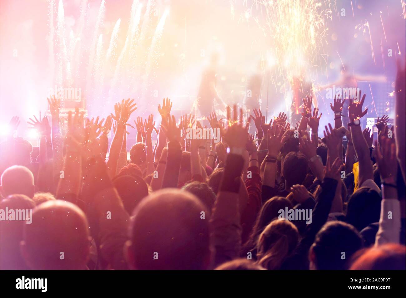 New Year concept - fireworks and cheering crowd celebrating the New ...