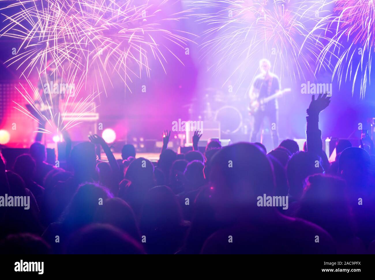 New Year concept - fireworks and cheering crowd celebrating the New ...