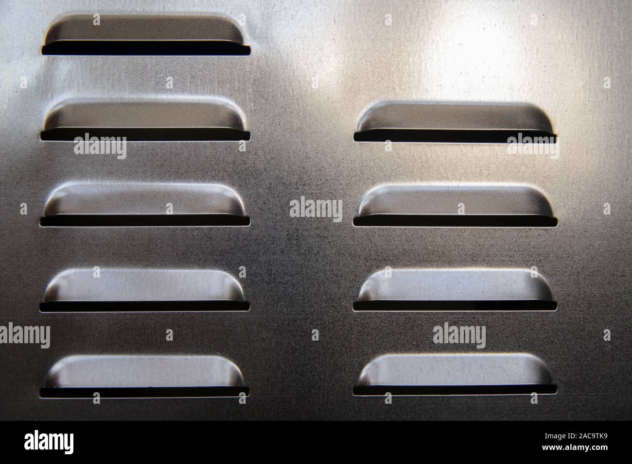 The texture of the metal ventilation cover of the gas stove Stock Photo ...