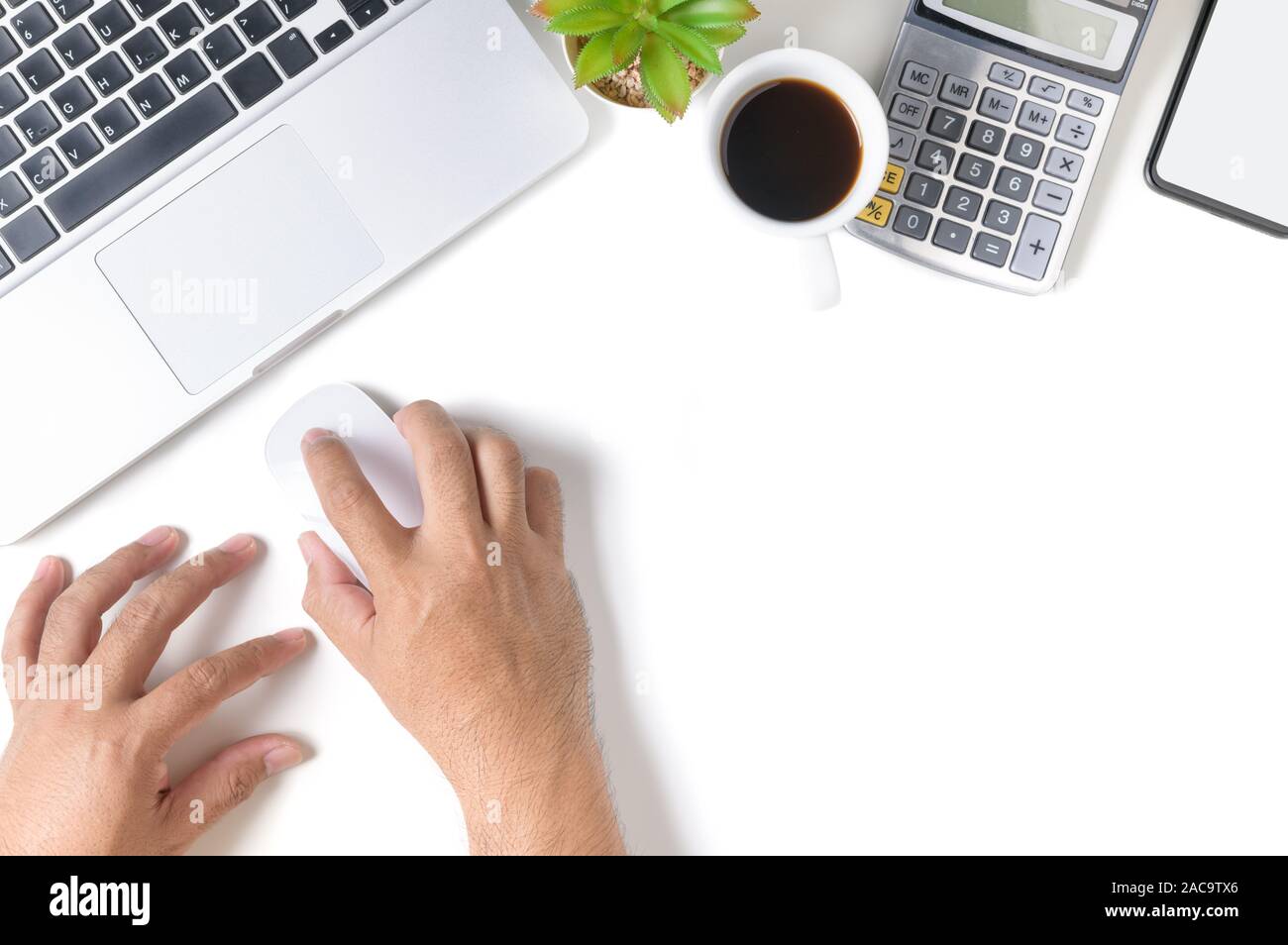White office desk table with hand man using mouse with laptop isolated ...