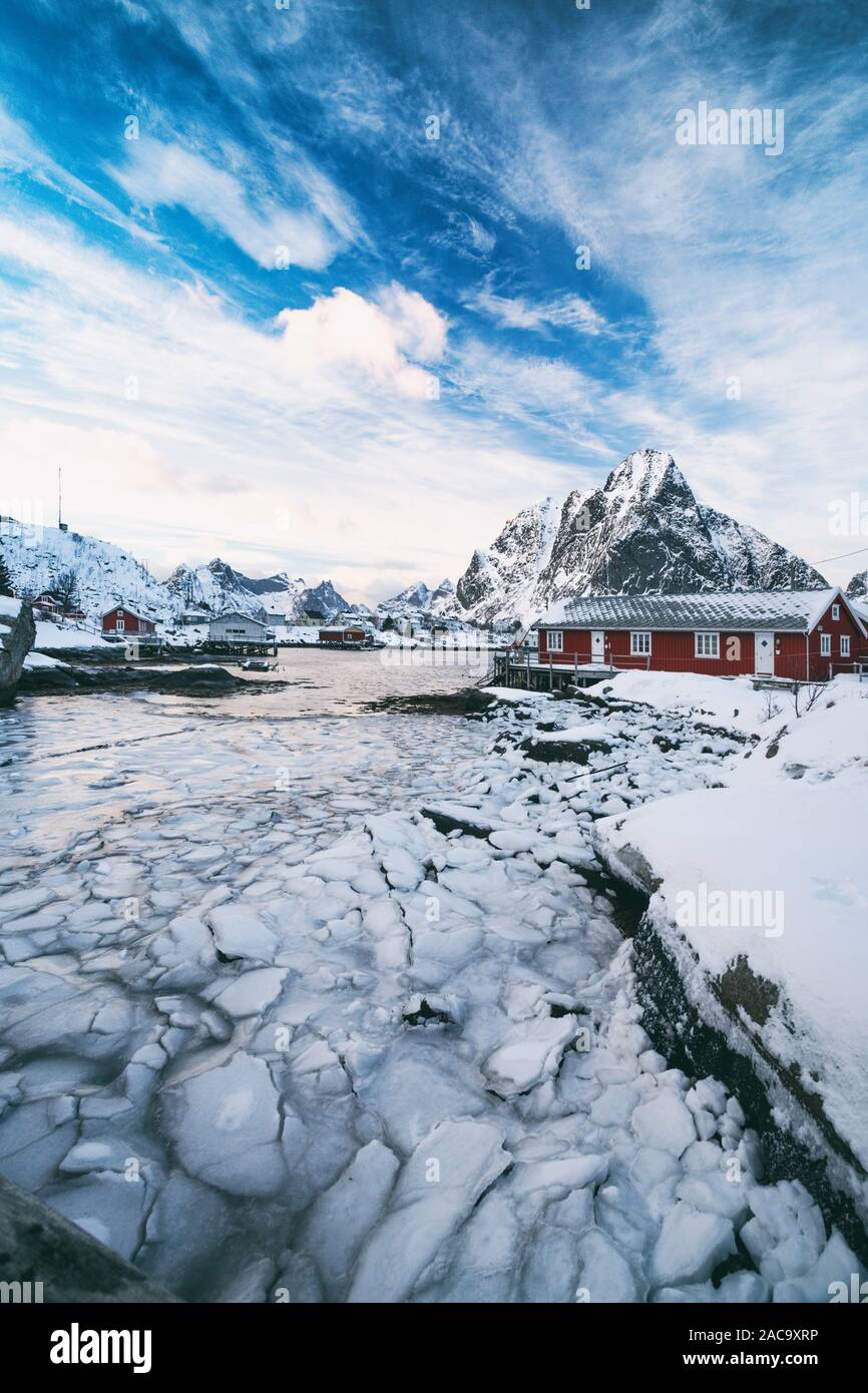 traditional norwegian wooden house rorbu to stand on the shore of the ...