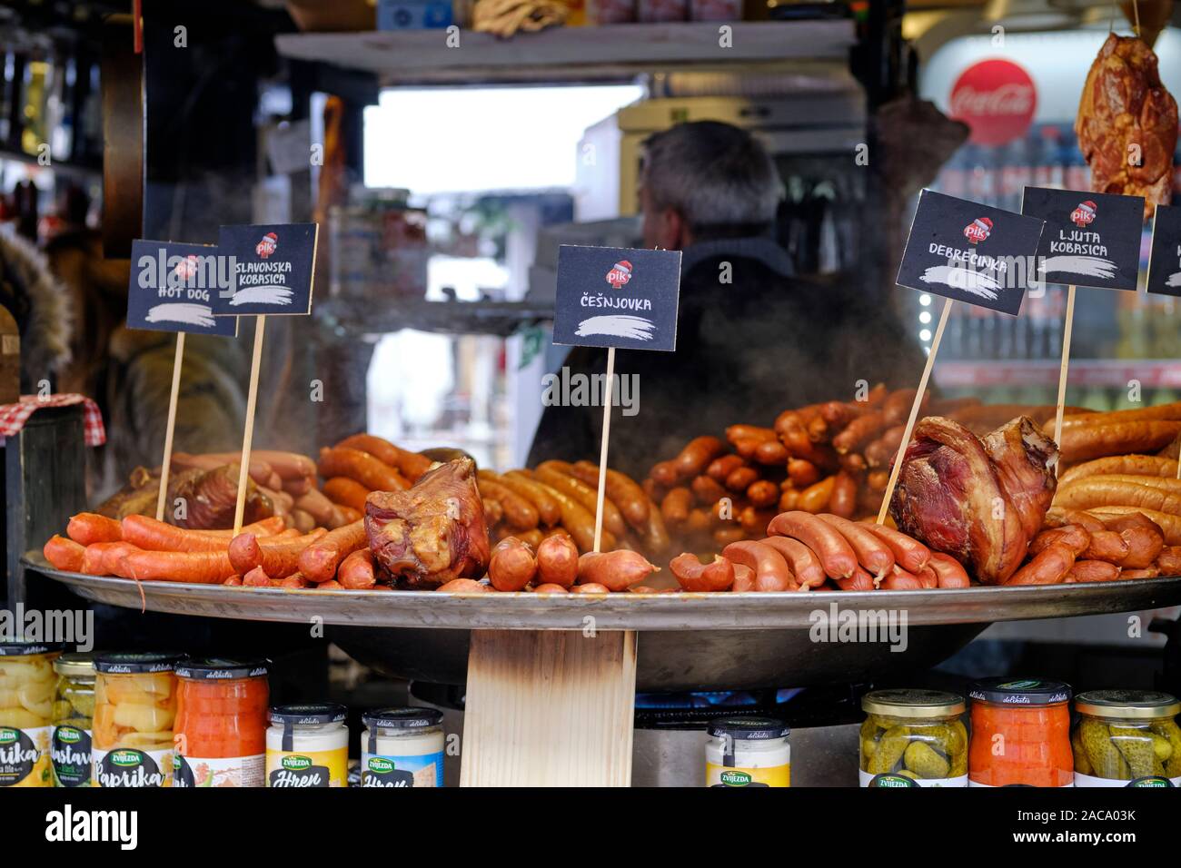 Selection of local traditional sausages around boiling pot at Advent ...