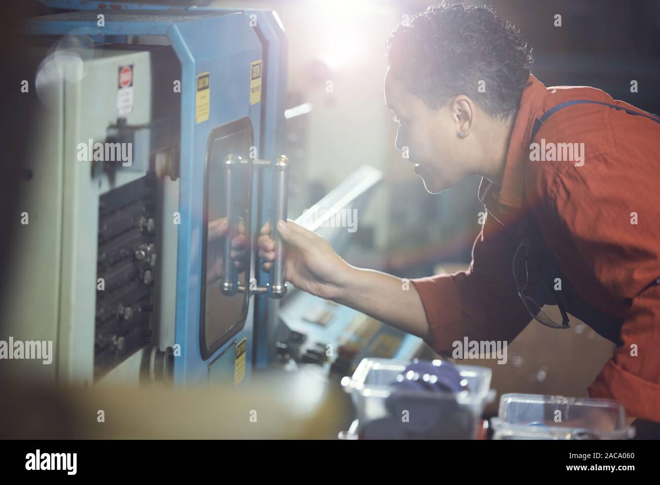 Side view young female industrial hi-res stock photography and images ...